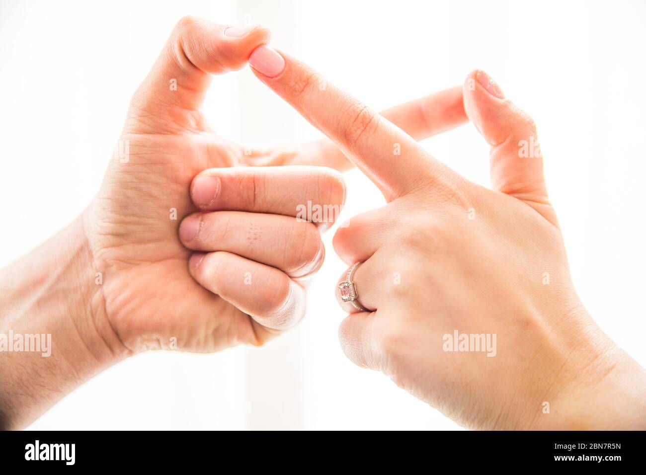 Man and Woman Creating Forever Sign with Joining Hands and Fingers ...
