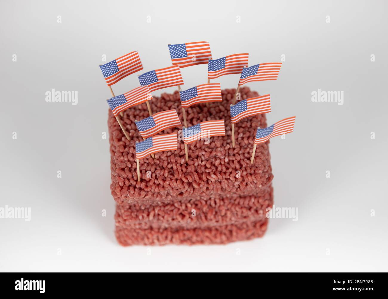 Pile of raw minced meat with lots of usa flags in it Stock Photo - Alamy