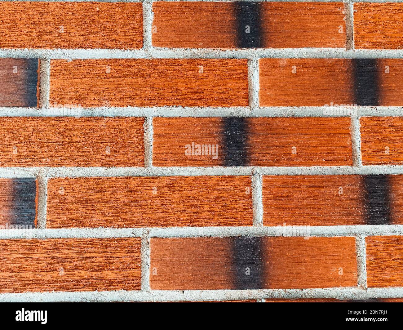 Red brick wall with textured brick. Contrast stitches. Durable masonry ...