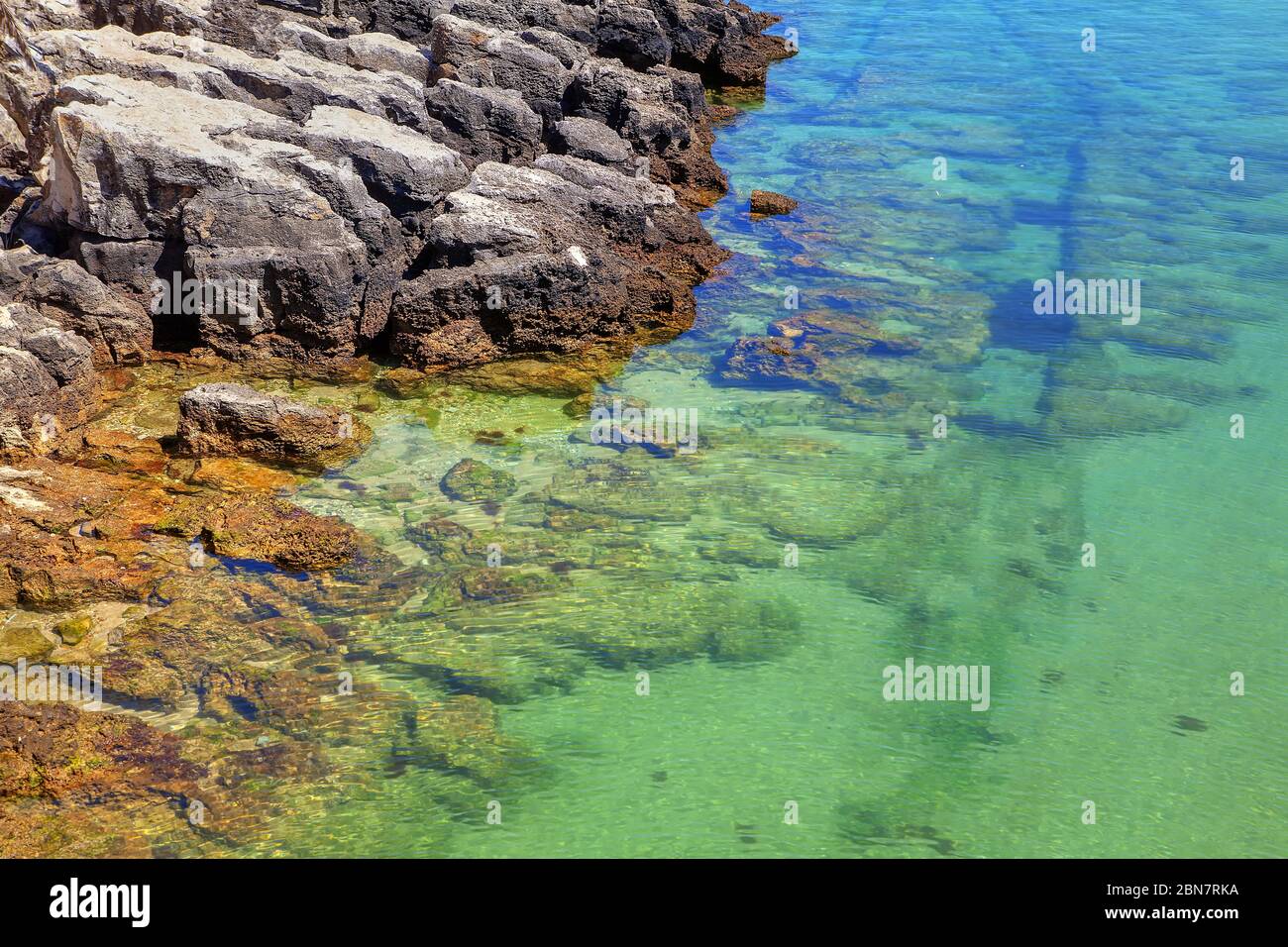 coastal rock formation , transparent ocean water Stock Photo - Alamy