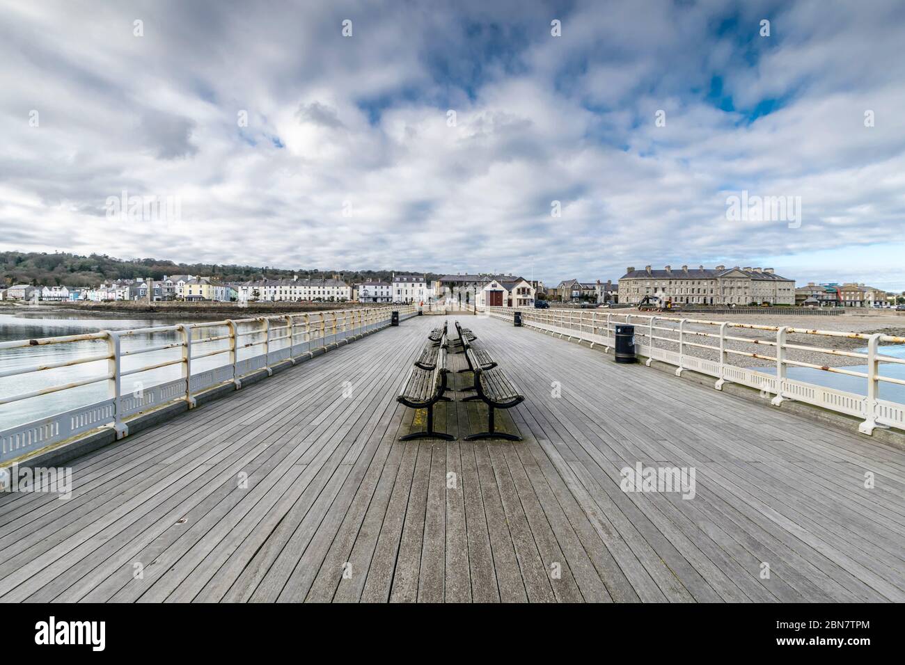 Beaumaris pier on Anglesey North Wales looking towards Beaumaris town ...