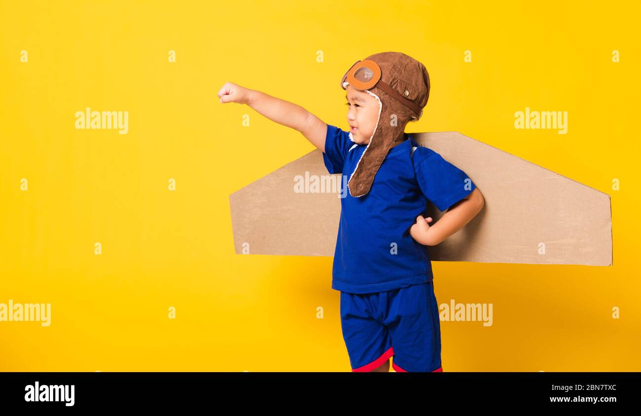 Happy Asian handsome funny child or kid little boy smile wear pilot hat ...