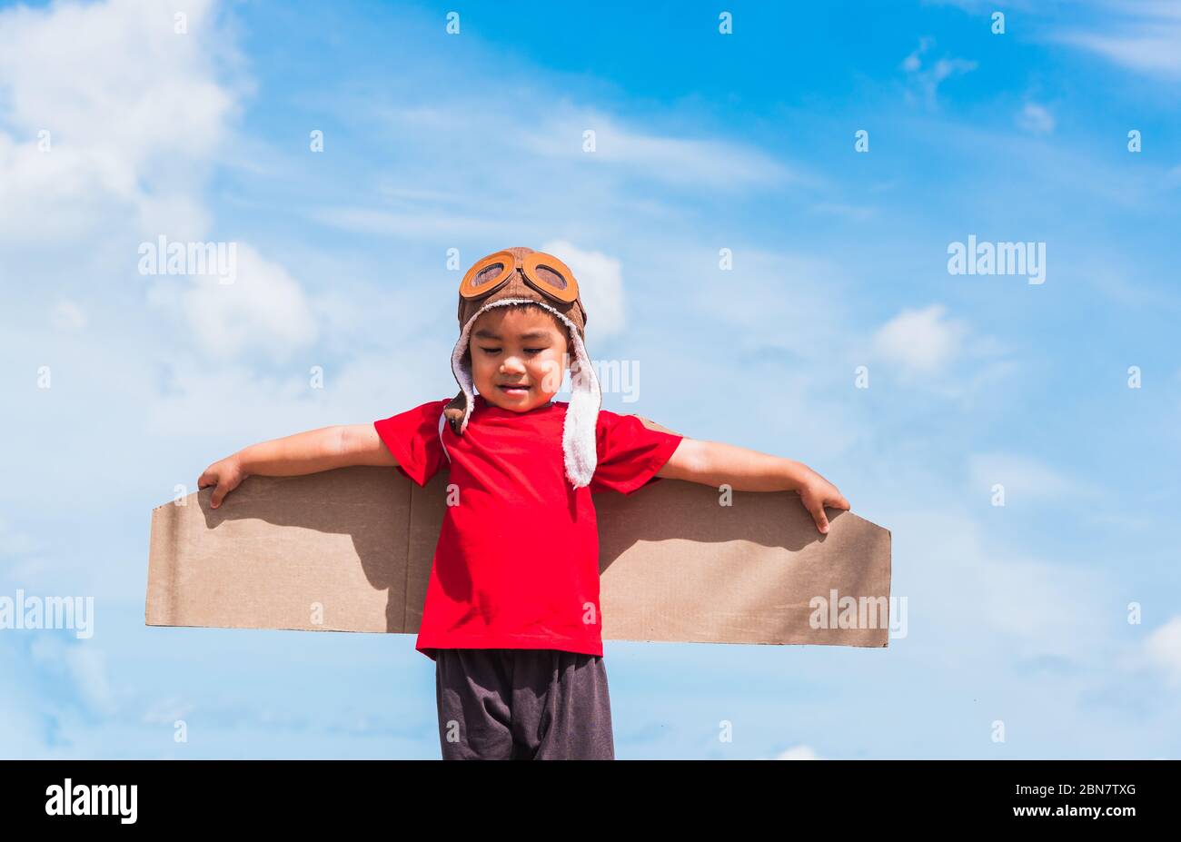 Happy Asian funny child or kid little boy smile wear pilot hat play and ...