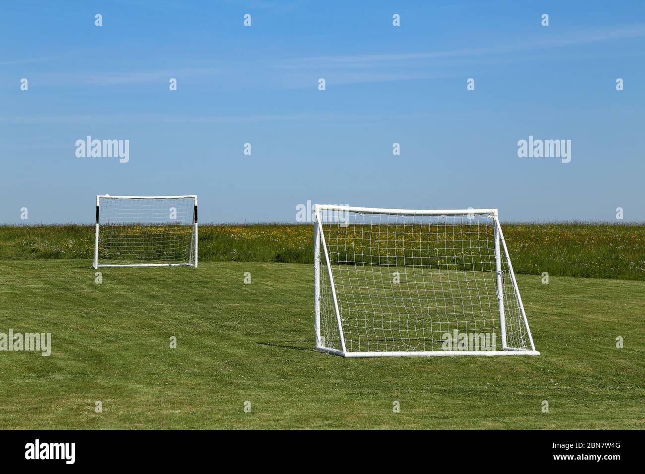 Football goal stand on a green lawn Stock Photo - Alamy