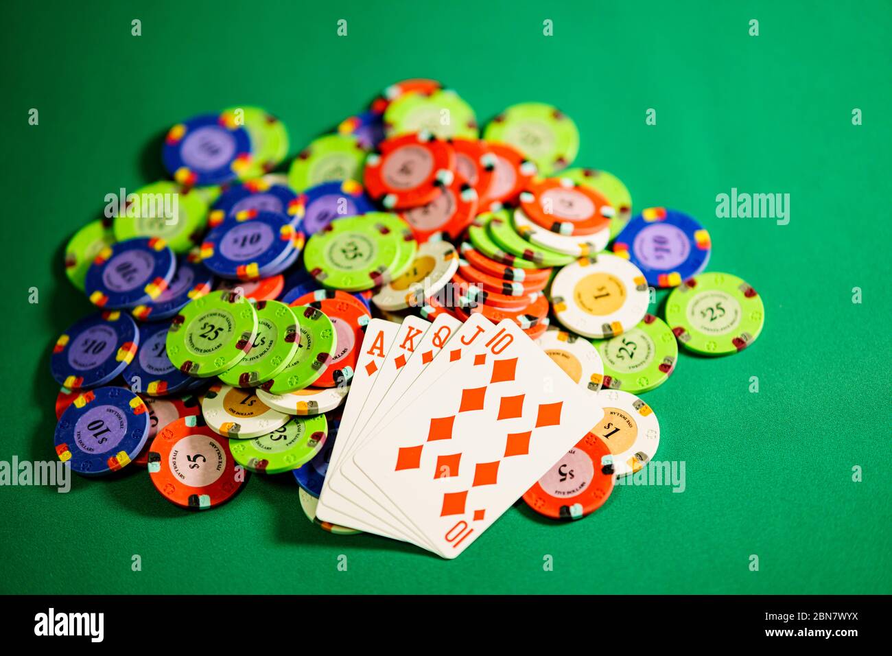 Poker game royal flush with chips Stock Photo - Alamy