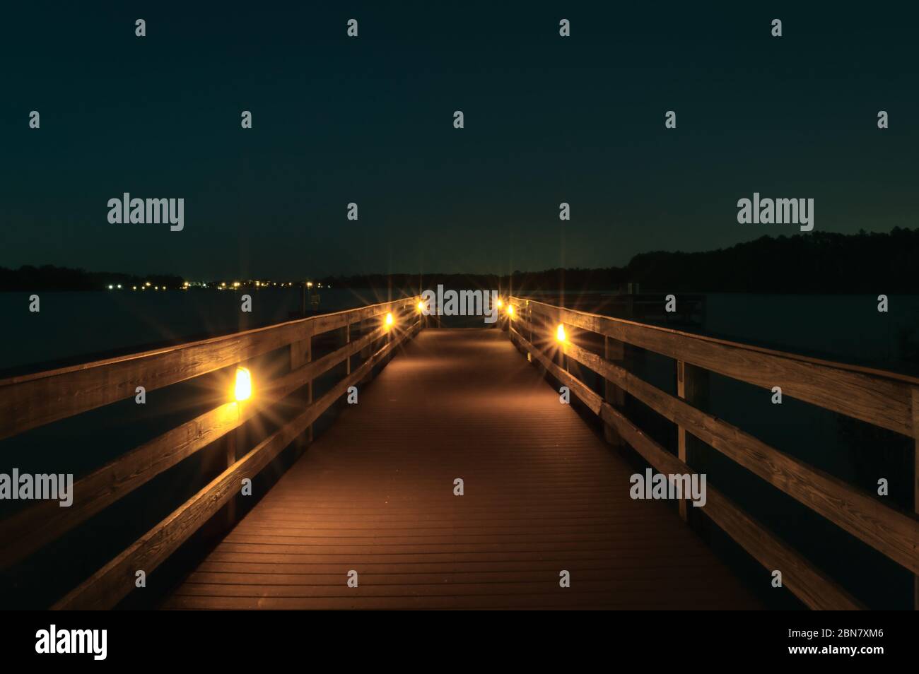 Sunset from a pier overlooking a lake with gators in Orlando, Florida ...