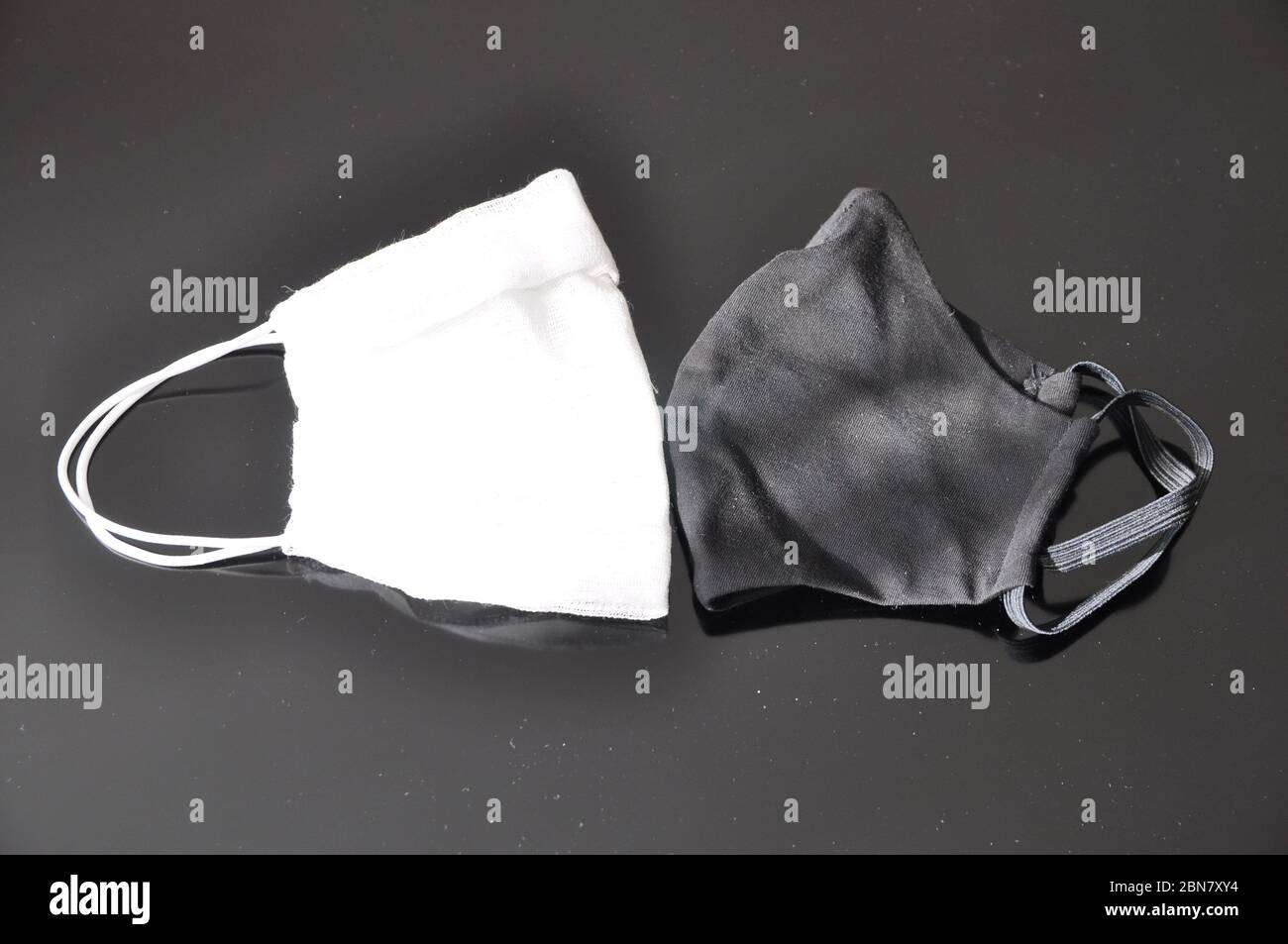 Two mask masks made of fabric, black and white. Respiratory protection ...