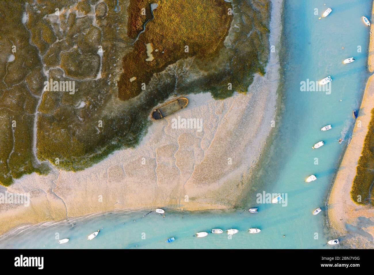 aerial view of a ship wrecked in a dry sea due to global warming next ...