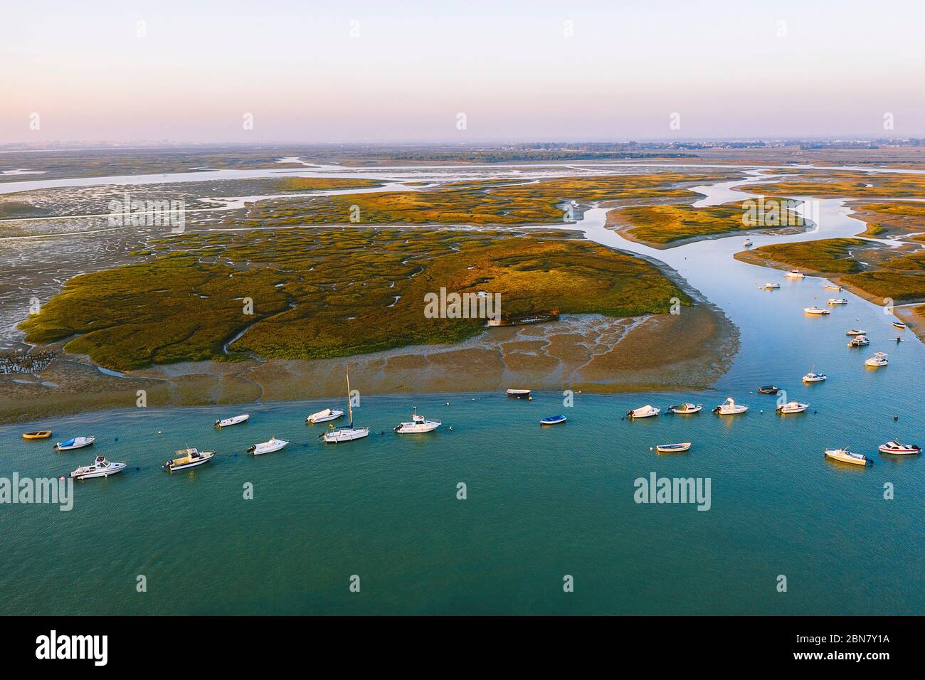 aerial view of marine wetlands at low tide with a ship wrecked and ...