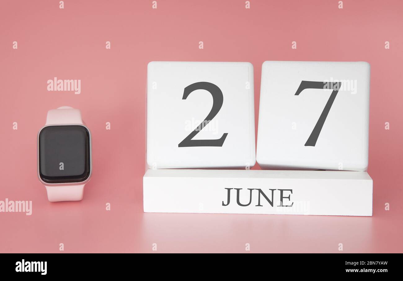 Modern Watch with cube calendar and date 27 june on pink background ...