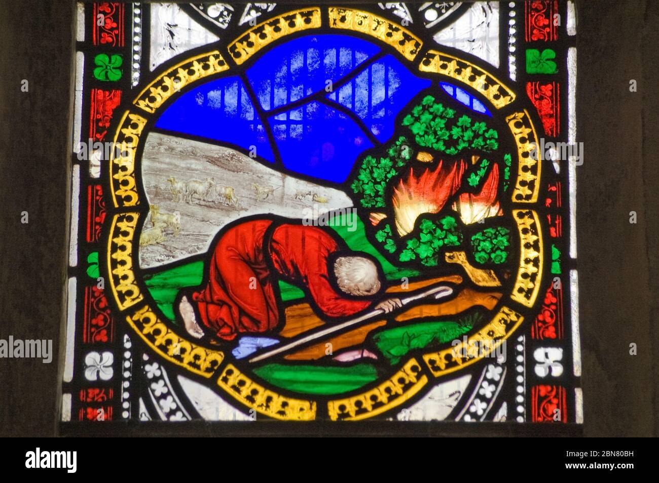 Victorian stained glass window showing Moses and the burning bush ...