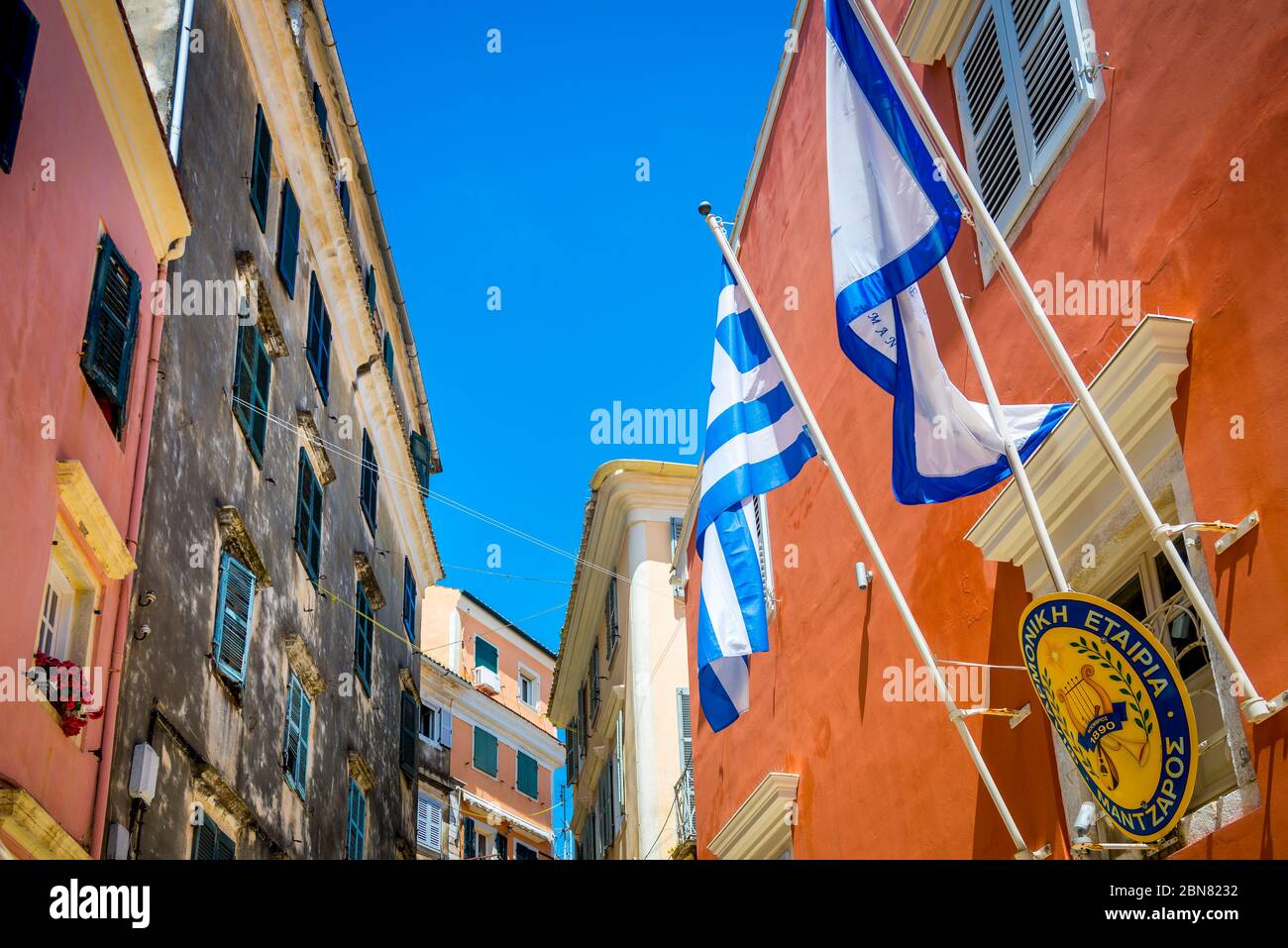 Flags outside a building in Old Town, Corfu, Greece Stock Photo - Alamy