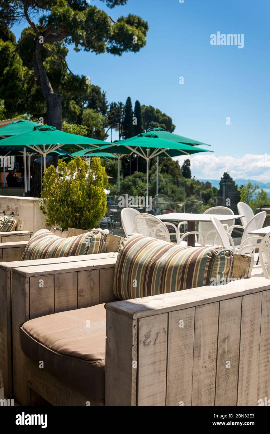 Empty seats on a hotel terrace in Corfu, Greece Stock Photo - Alamy