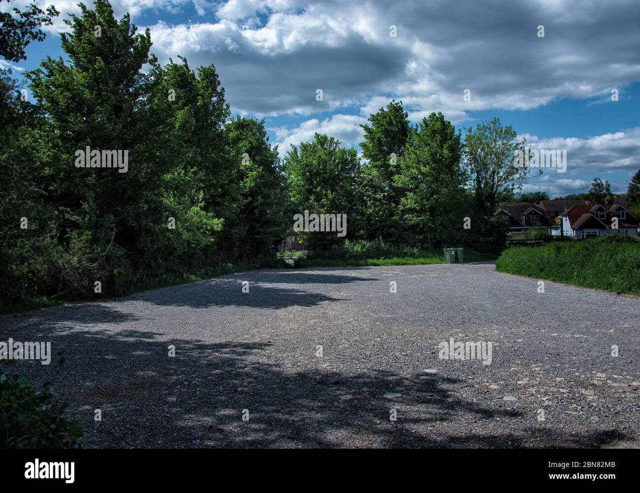 An empty car park next to a dog walkers field and playground. This has ...