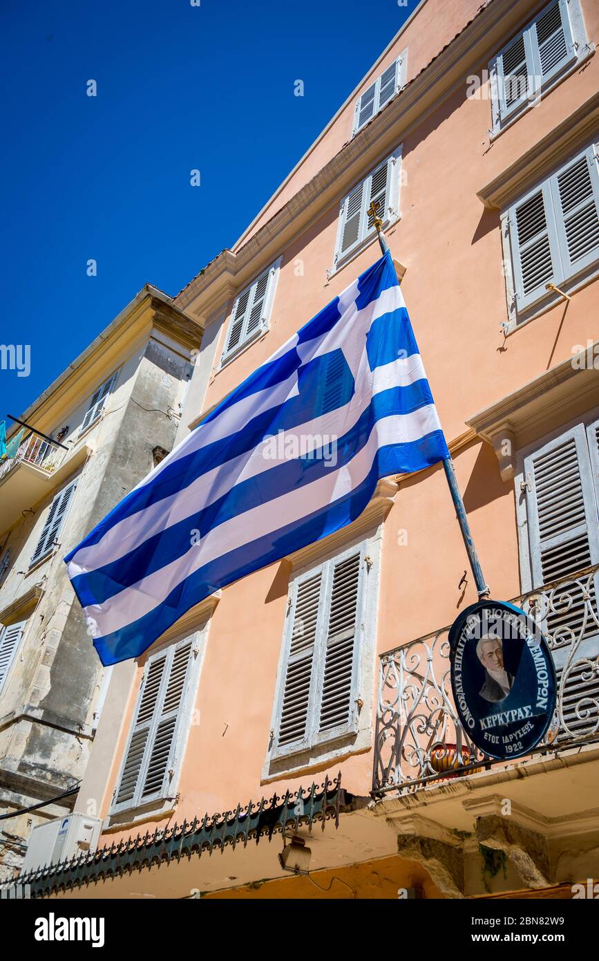 Greek flag flying from a balcony in Old Town Corfu, Greece Stock Photo ...