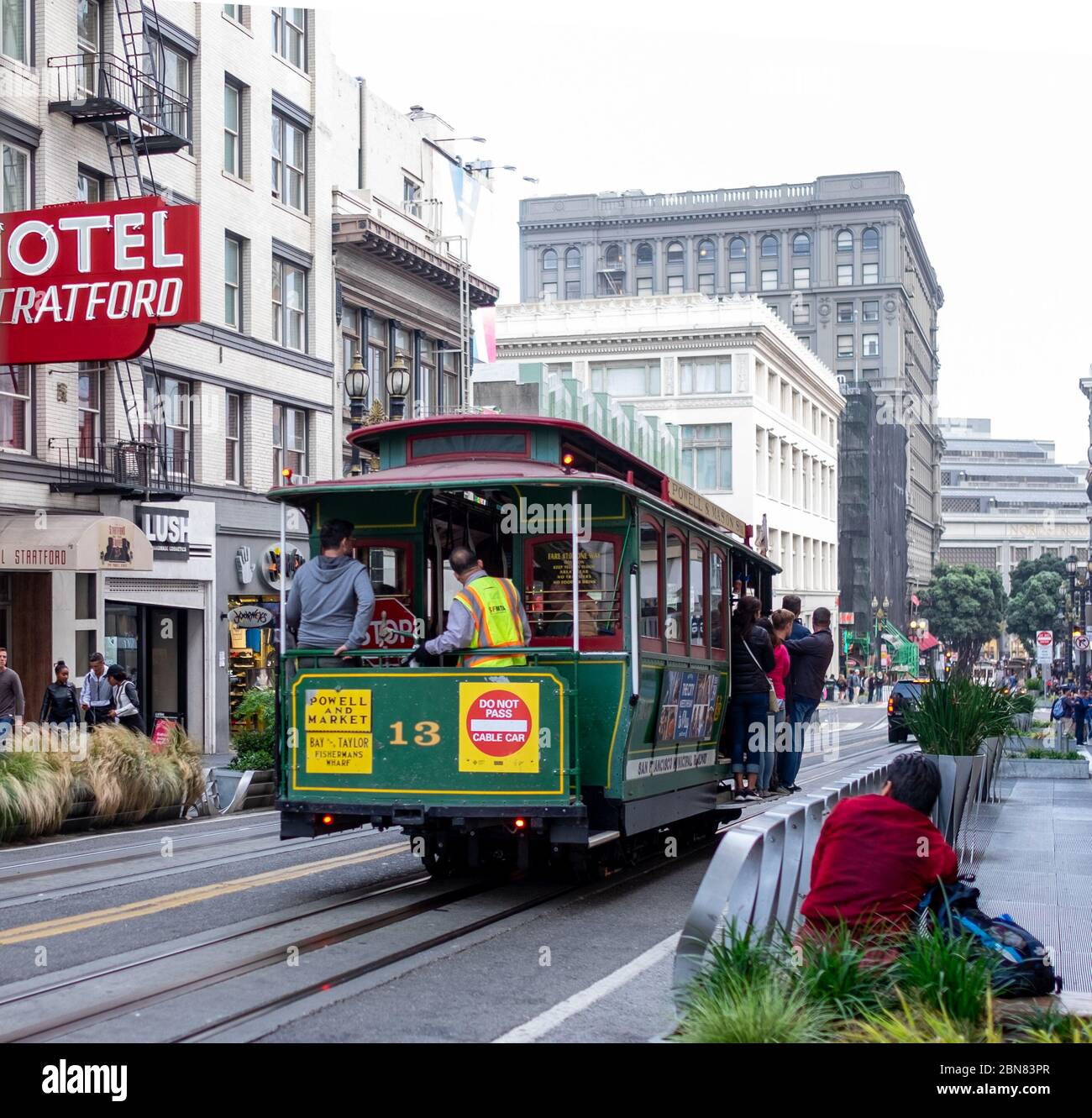 An iconic street car makes its way through the streets of San Francisco ...