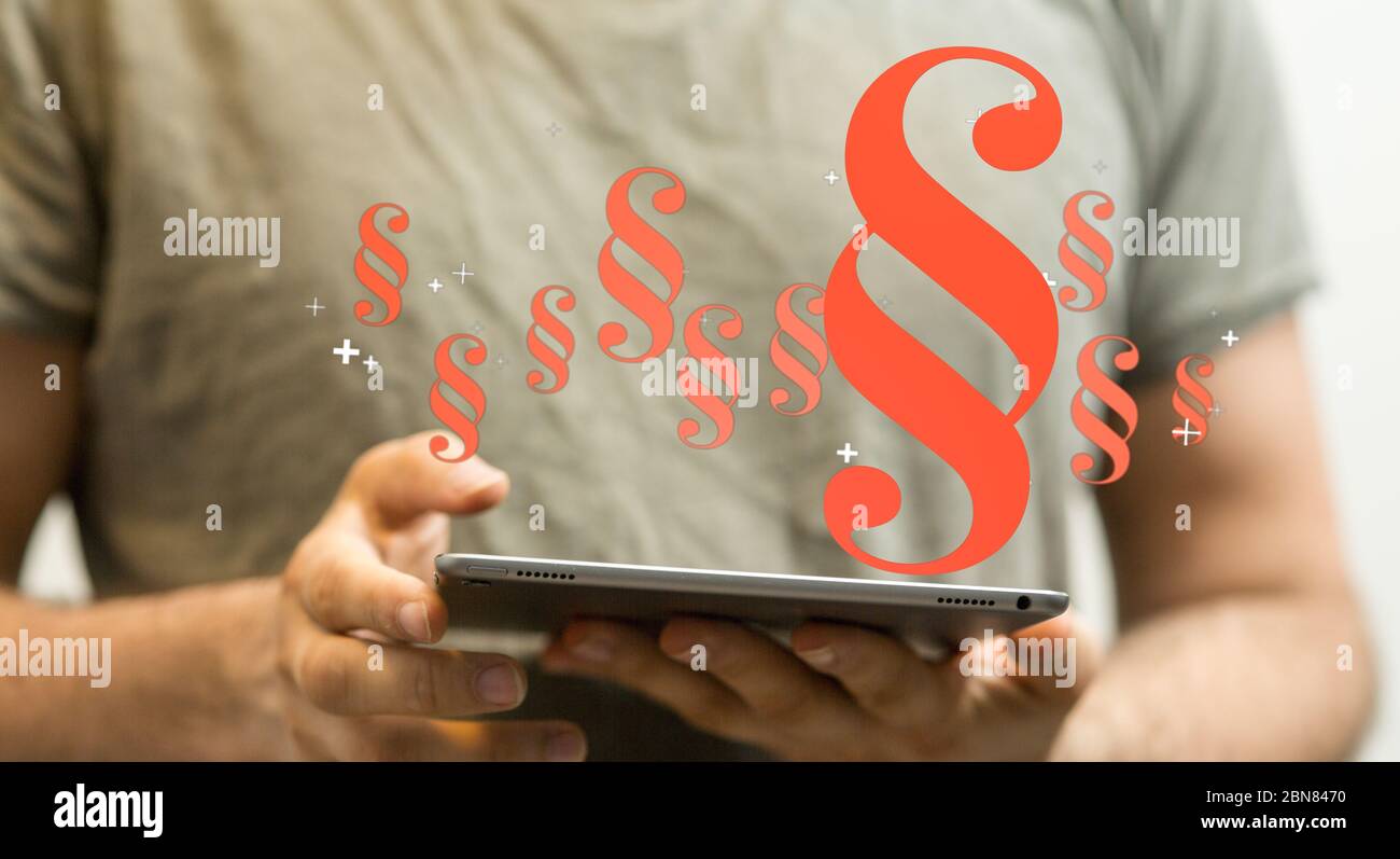 A paragraph law sign in hand Stock Photo - Alamy