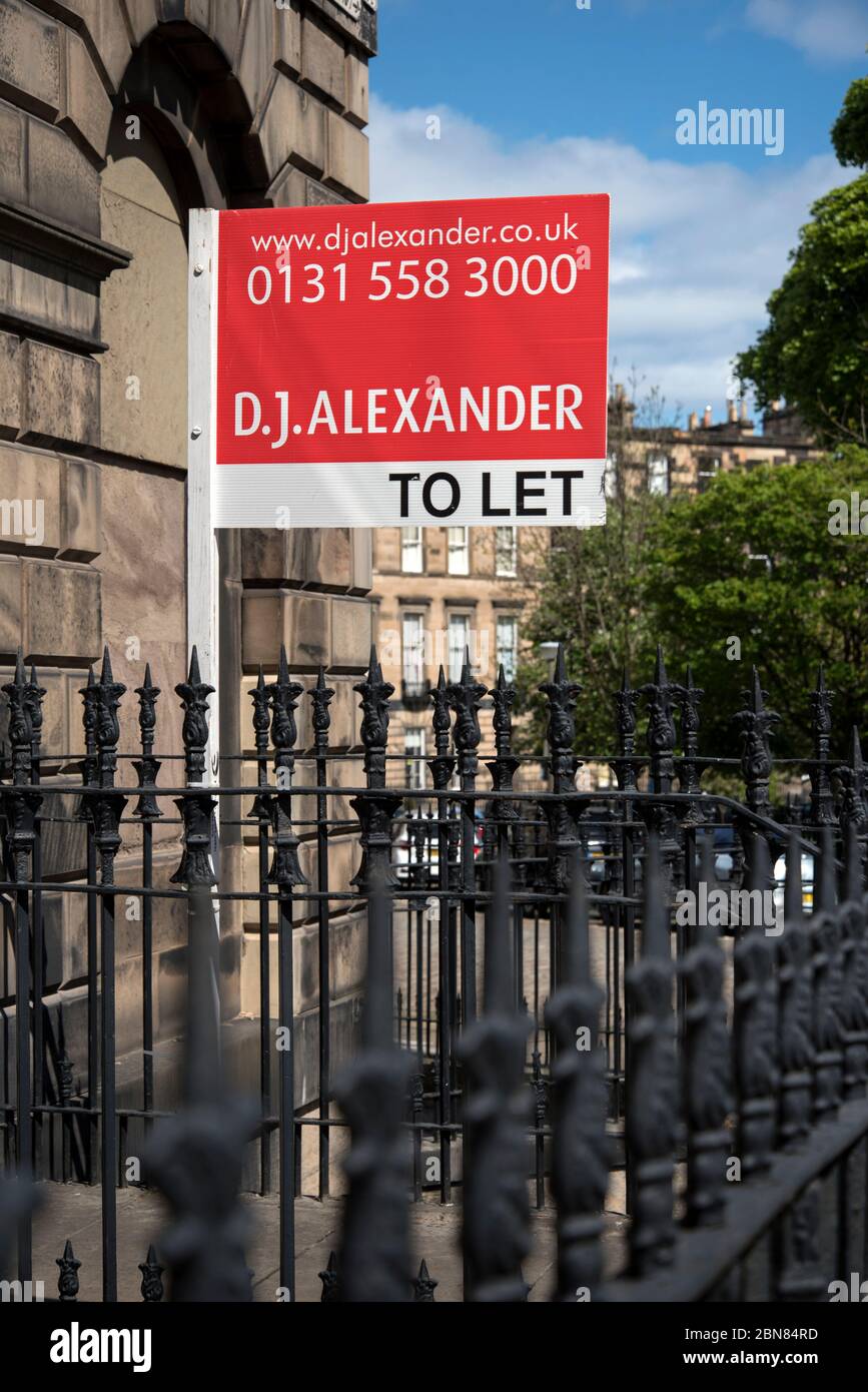 An estate agent's "To Let" sign attached to railings in Edinburgh's ...