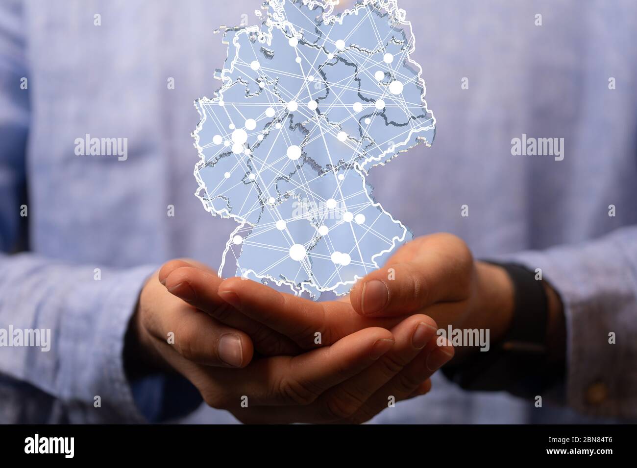 A a virtual germany land map digital in hand 3d Stock Photo - Alamy