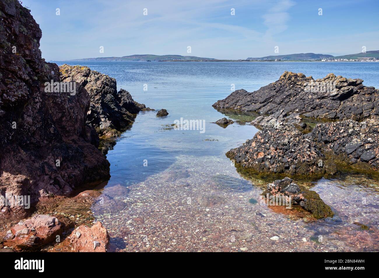 Rocks on Langness Peninsular with view across Castletown Bay Stock ...