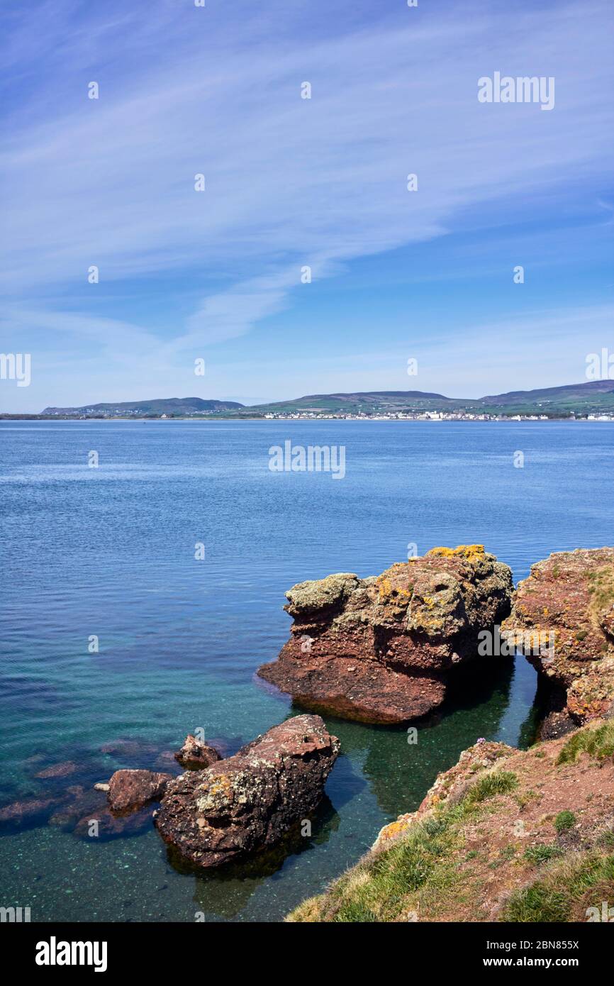 Rocks on Langness Peninsular with view across Castletown Bay Stock ...