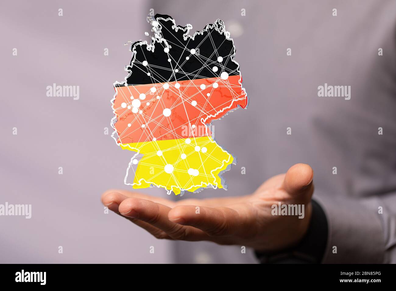 A a virtual germany land map digital in hand 3d Stock Photo - Alamy