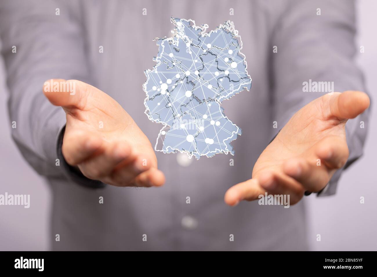 A a virtual germany land map digital in hand 3d Stock Photo - Alamy