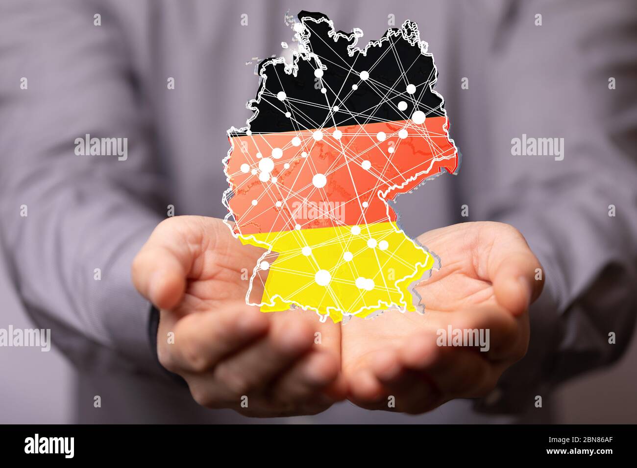 A a virtual germany land map digital in hand 3d Stock Photo - Alamy