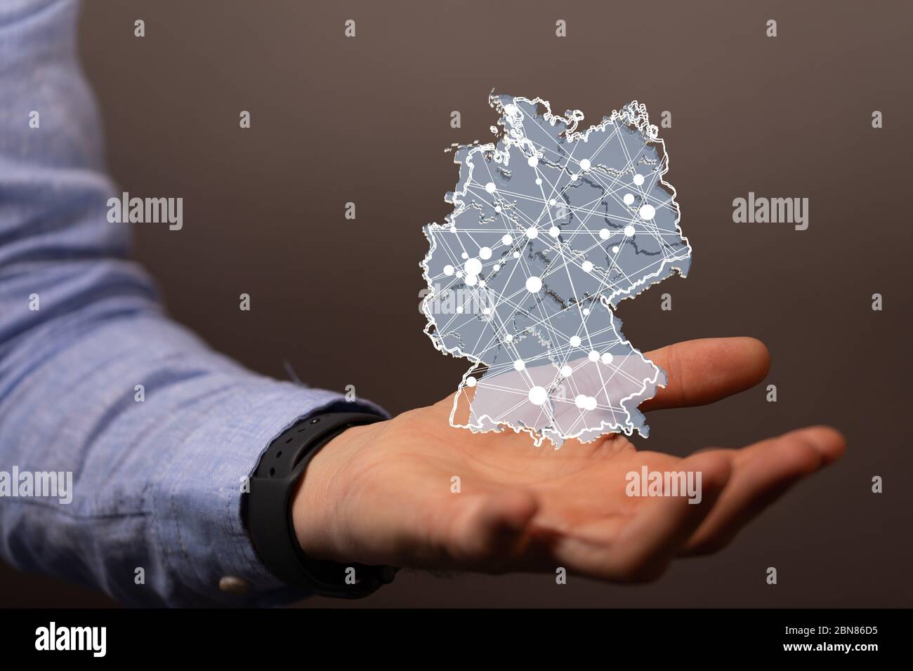 A a virtual germany land map digital in hand 3d Stock Photo - Alamy