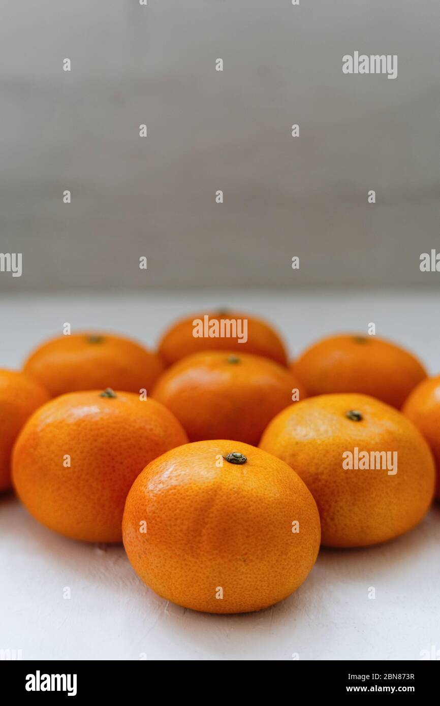 Side View Of Some Juicy Tangerines On A Wooden Table Stock Photo - Alamy