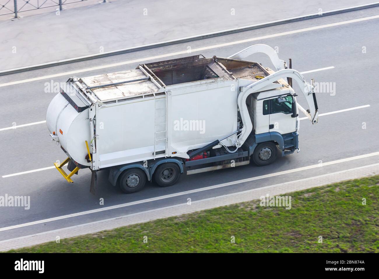 Truck for waste collection in residential areas of the city rides on ...