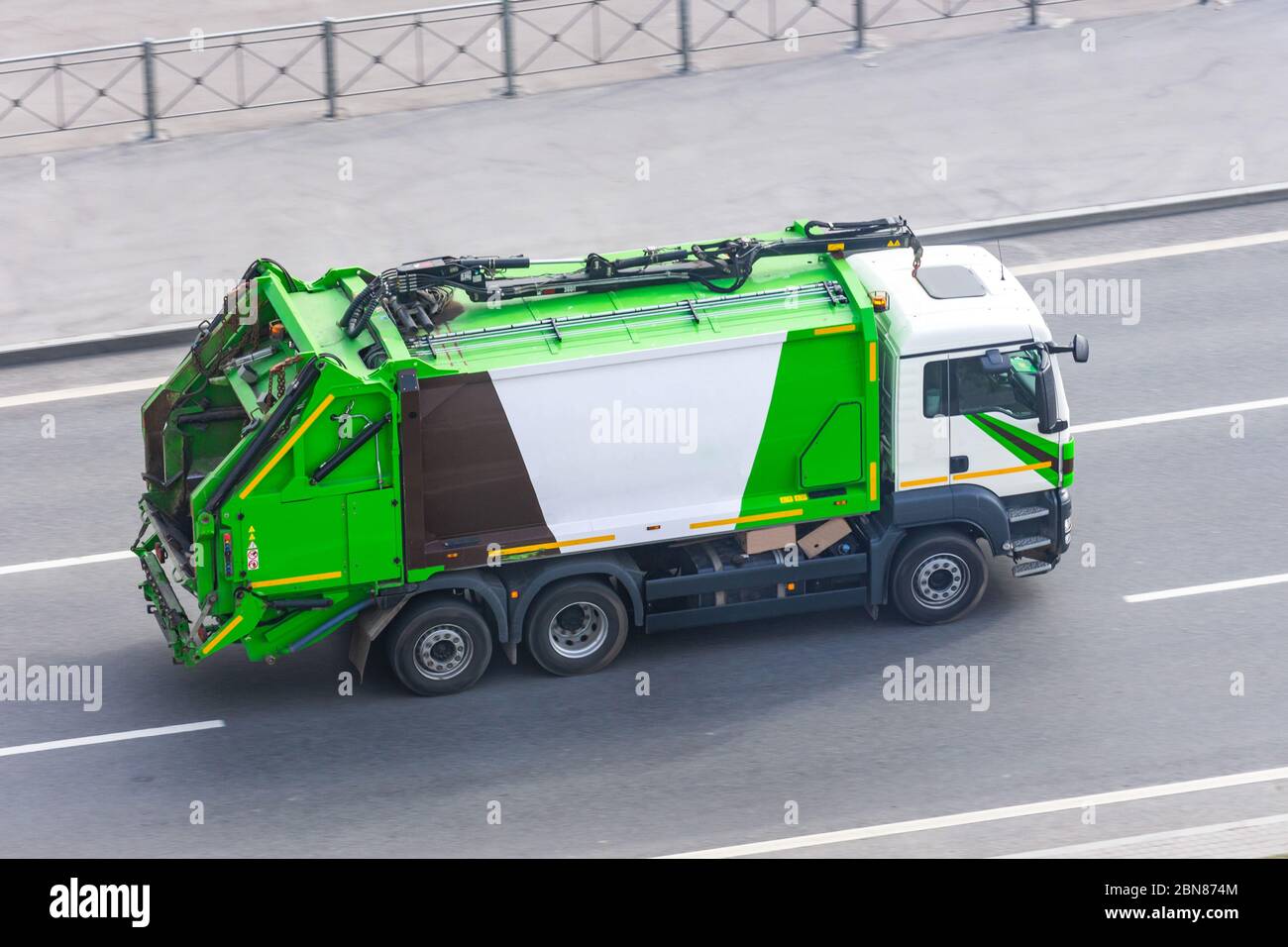 Truck for waste collection in residential areas of the city rides on ...