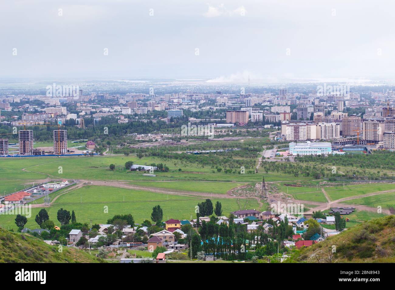 View of the city from the mountain. Summer landscape. Kyrgyzstan ...