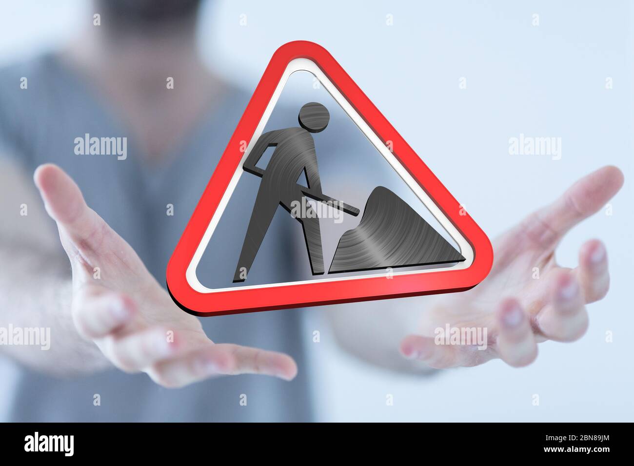 A under process sign in hand Stock Photo - Alamy