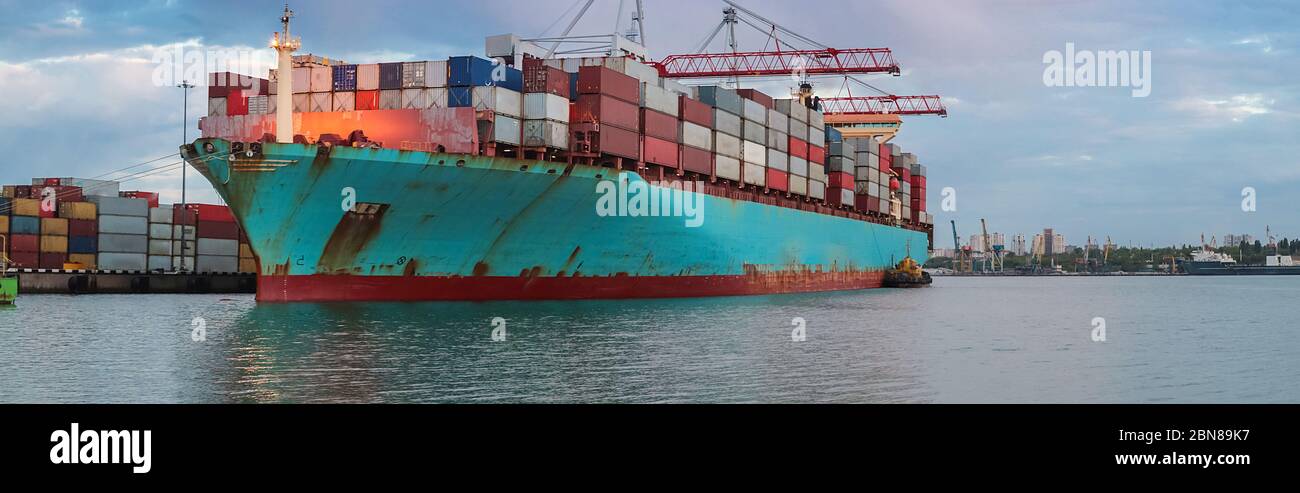 Container cargo ship load in the seaport. Logistics and transportation ...