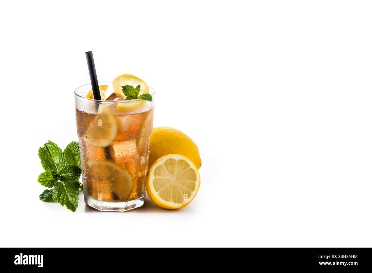 Iced tea drink with lemon in glass isolated on white background. Copy ...