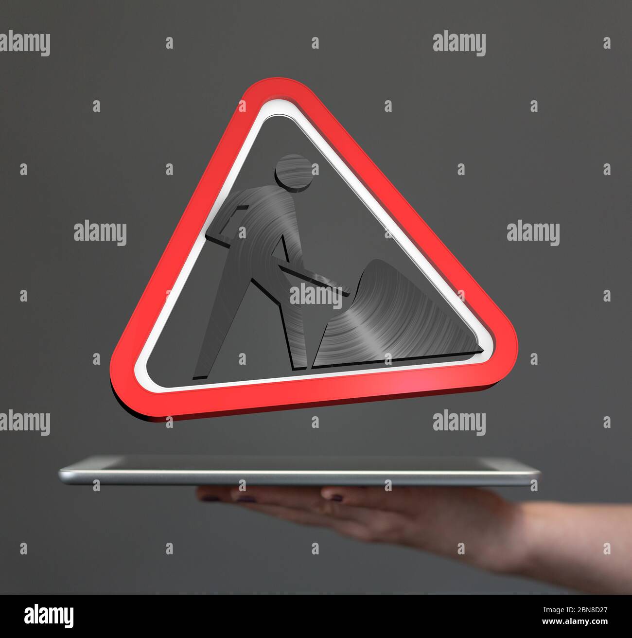 A under process sign in hand Stock Photo - Alamy