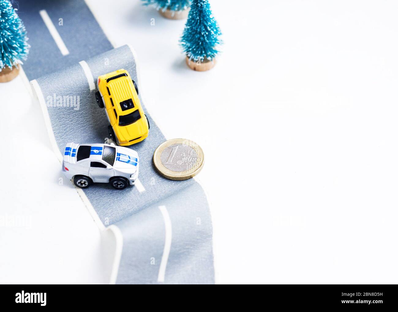 Cars accident on rough road. Expensive insurance. Incident. Toy models ...
