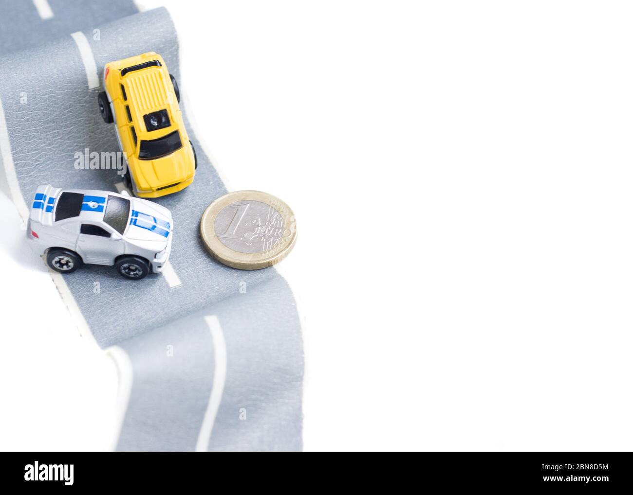 Cars accident on rough road. Expensive insurance. Incident. Toy models ...