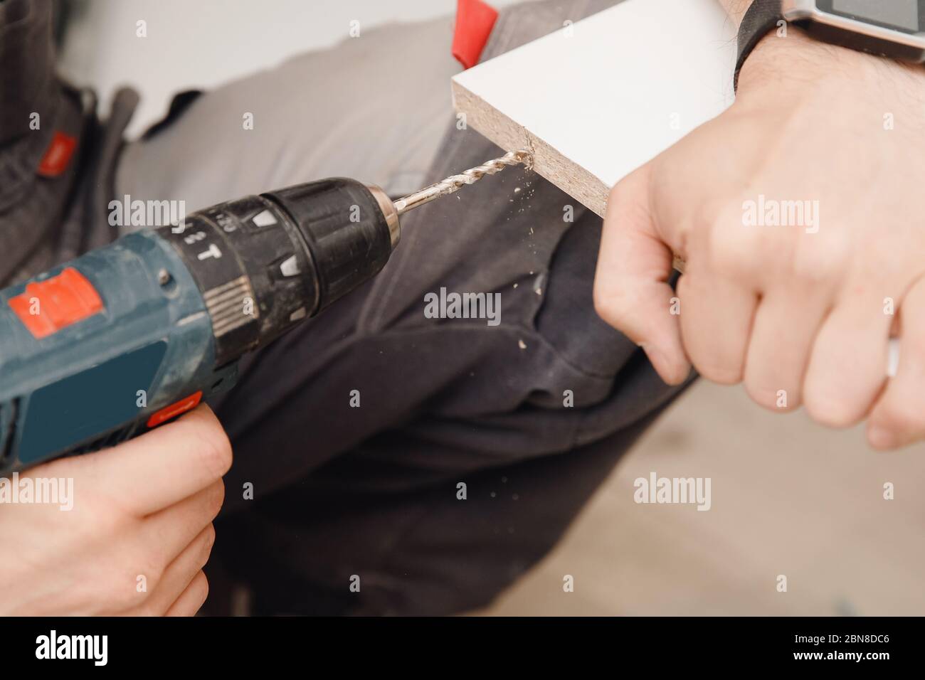 Kitchen installation, worker furniture assembly with tools Stock Photo ...