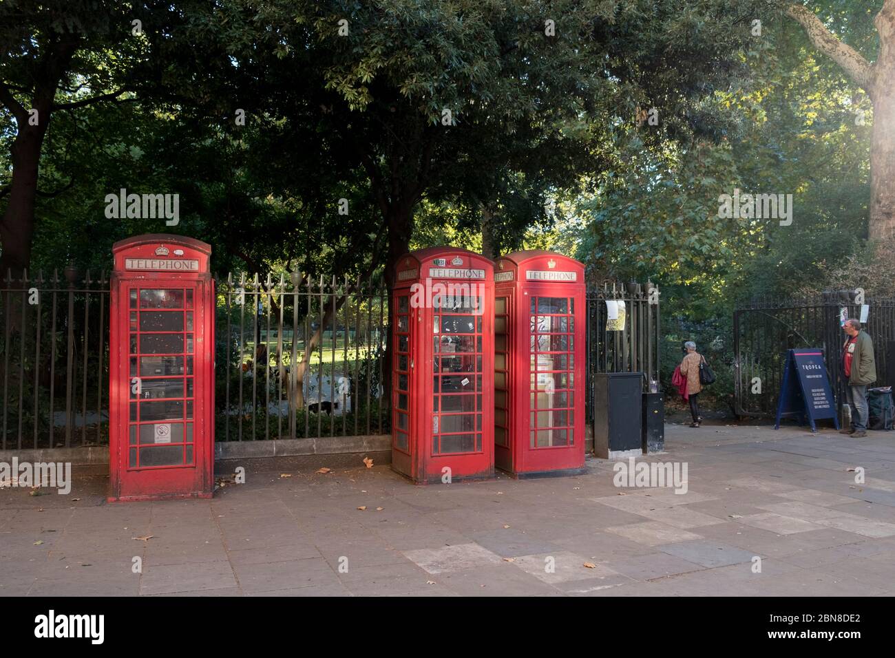Three iconic British red telephone booths situated outside of Russel ...