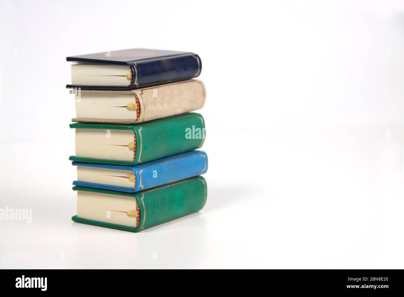 vertical pile of books isolated on white background horizontal image ...