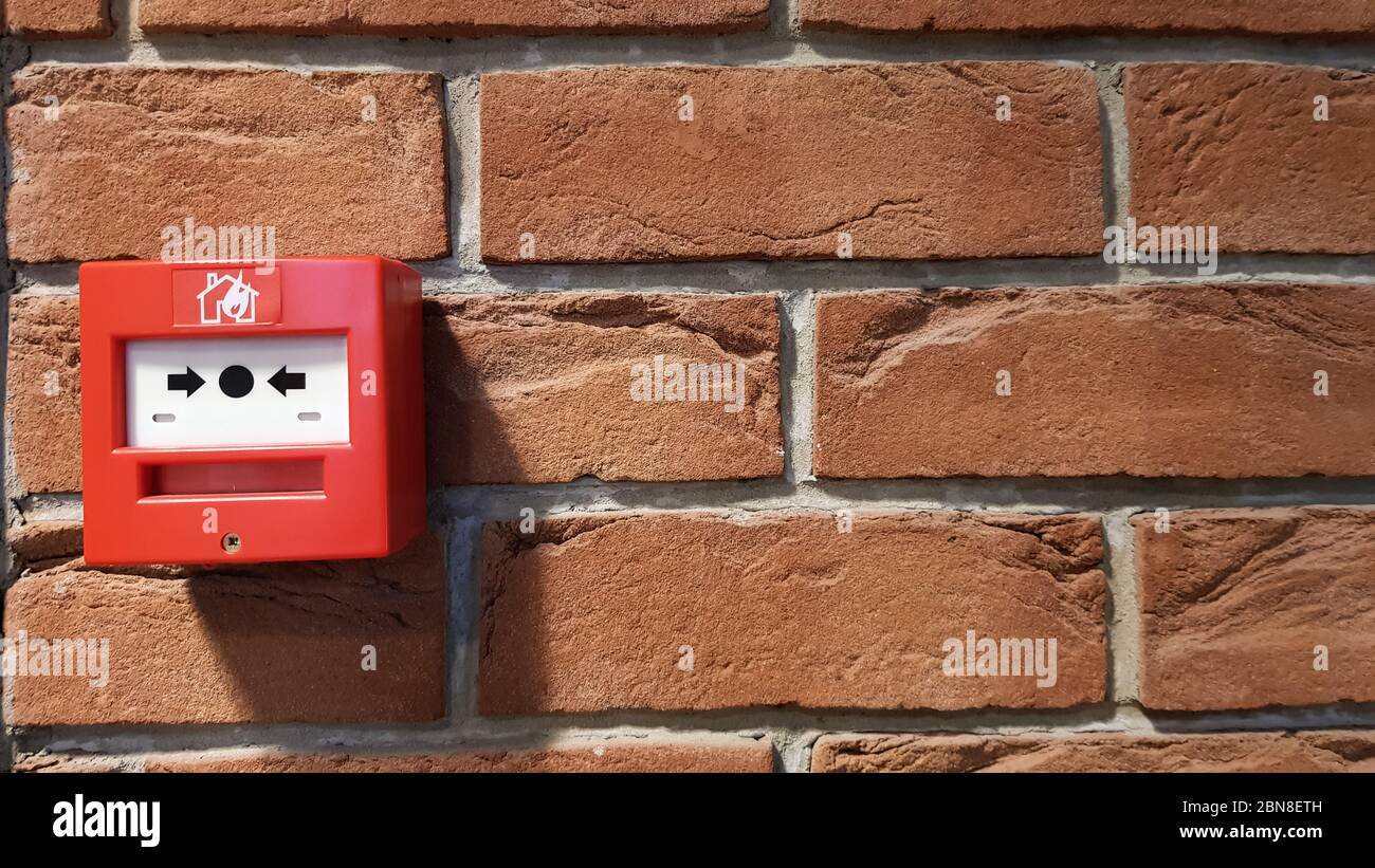 fire alarm system box installed on wall in building Stock Photo - Alamy