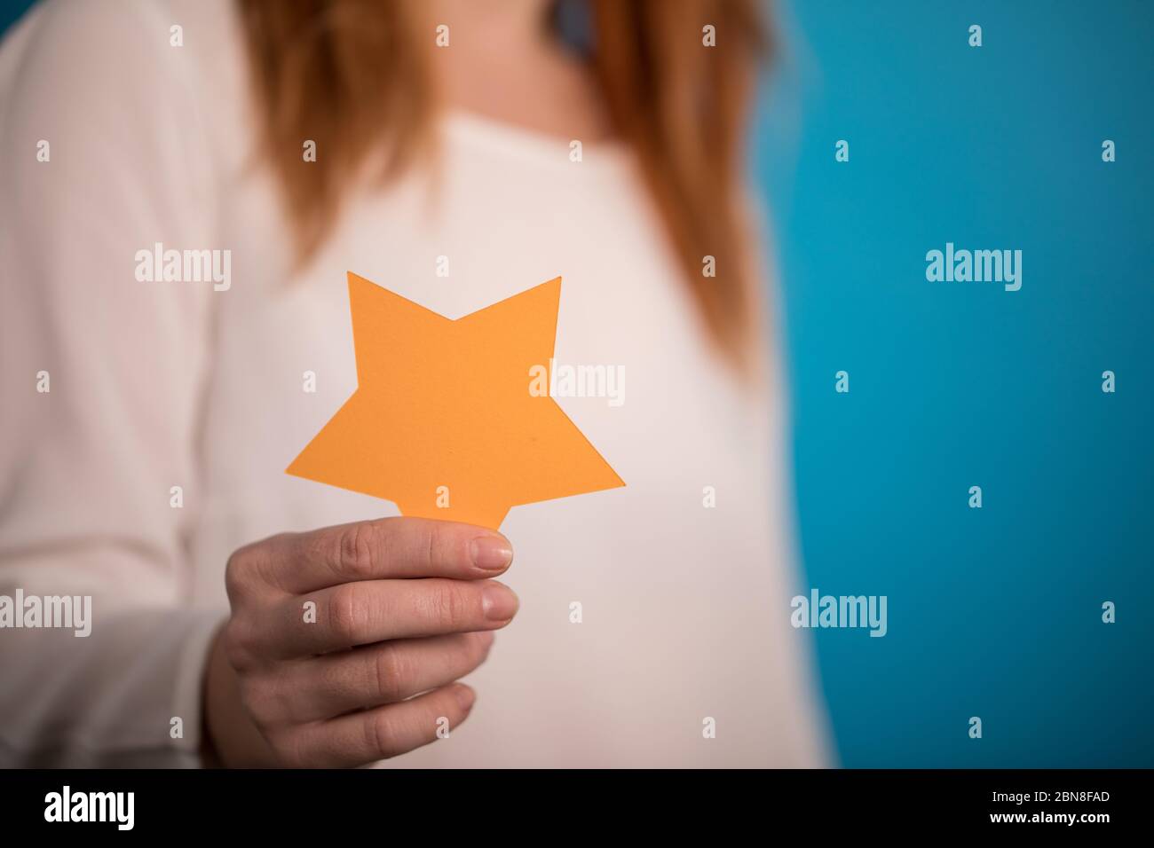 Hand holding star on hi-res stock photography and images - Alamy