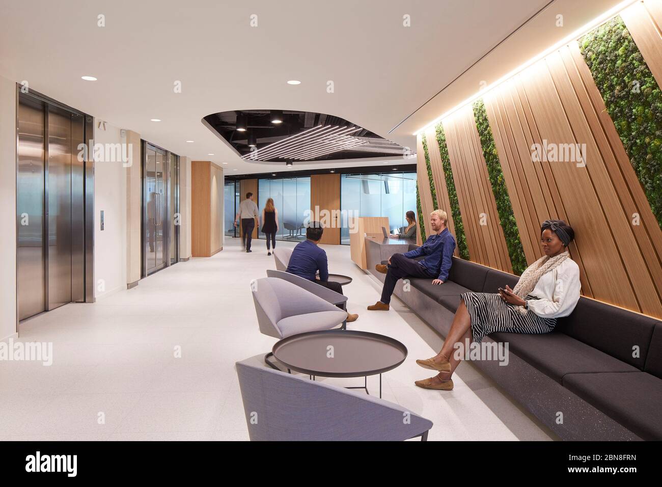 People sitting in reception. Office interior with smart contemporary ...