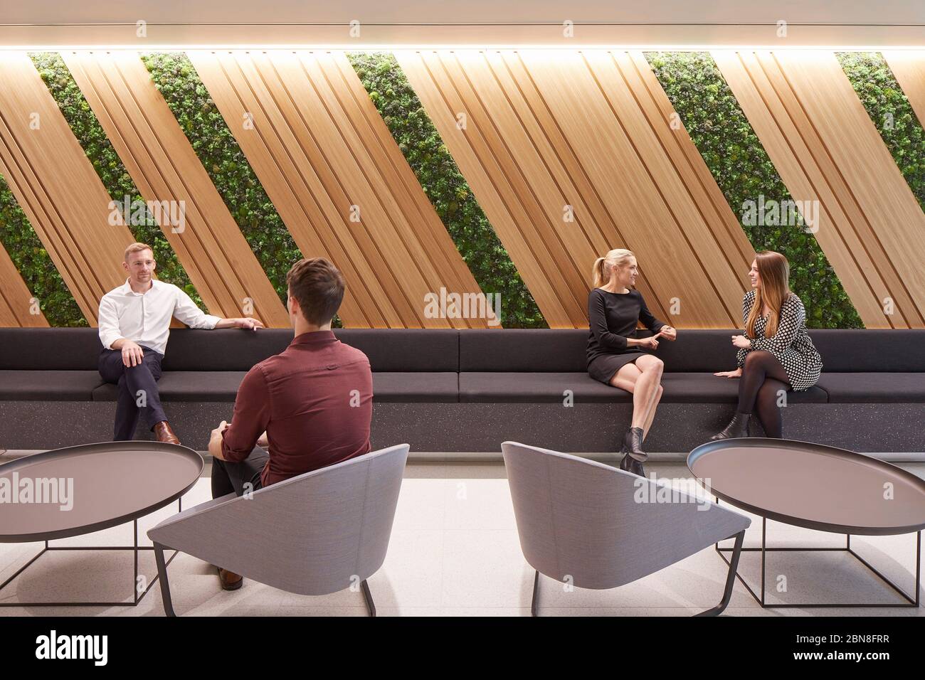 People sitting in reception. Office interior with smart contemporary ...