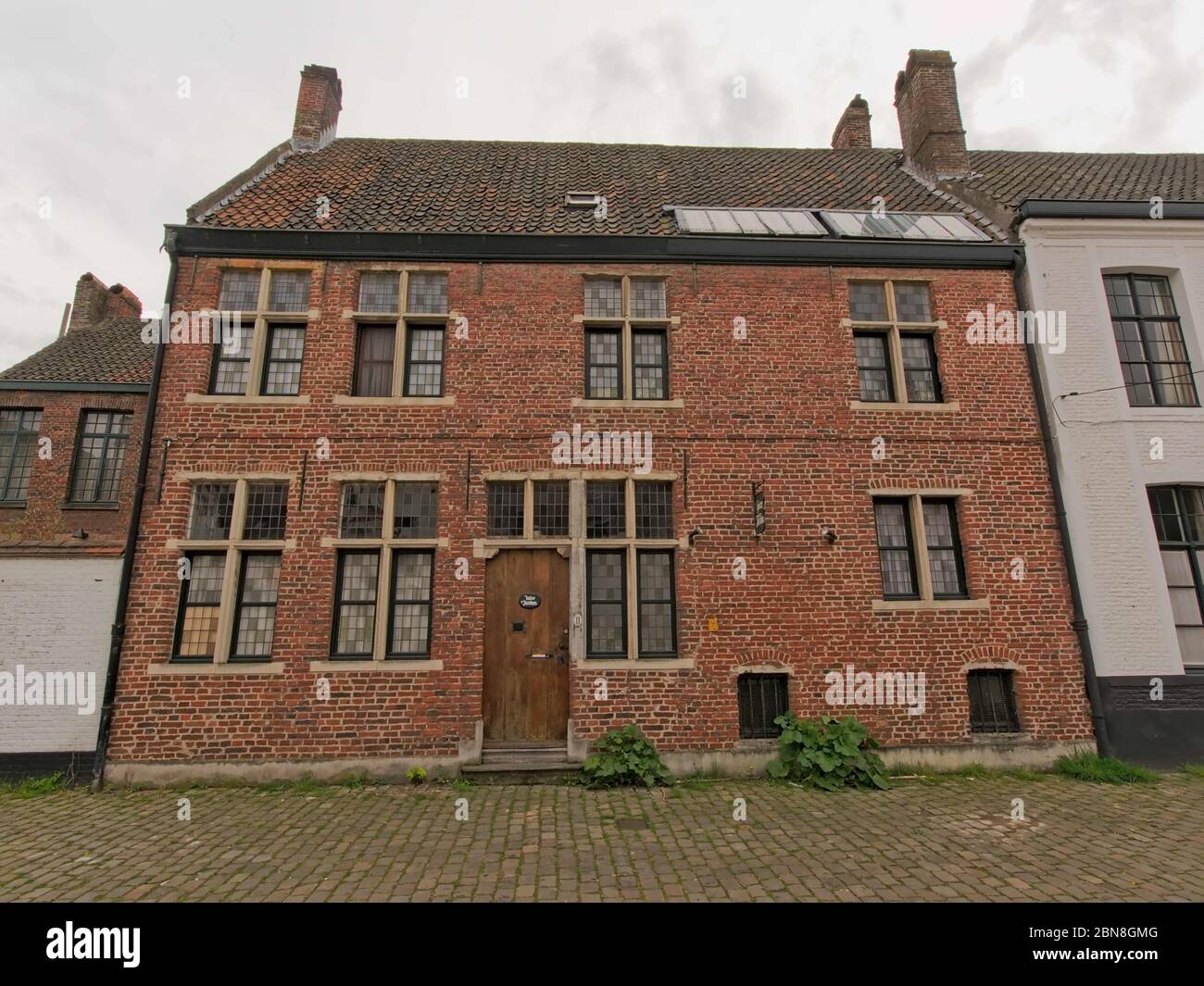 Cobblestone streets with small cosy brick house in the Holy corner or ...