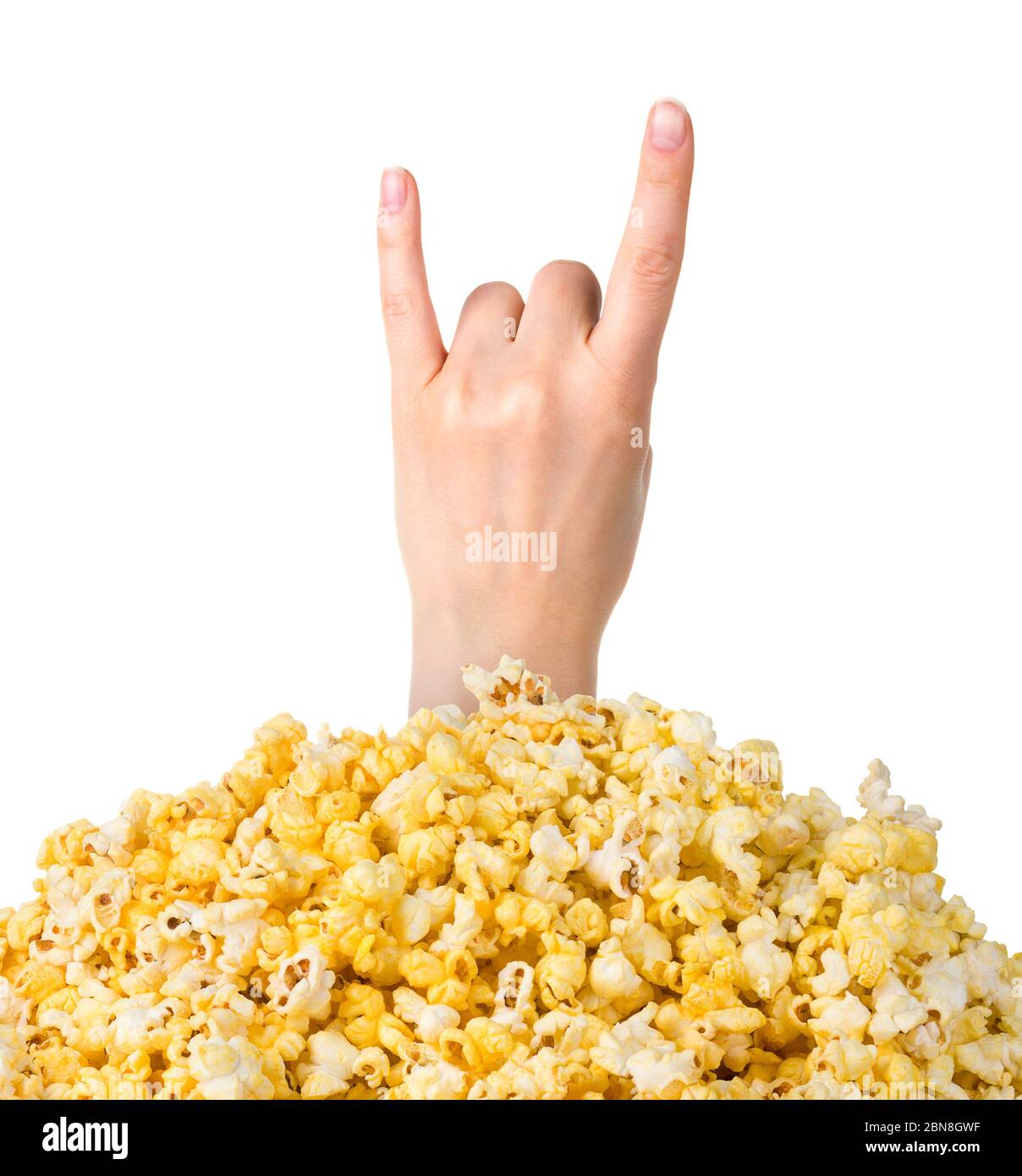 Female hand sticks out of a pile of popcorn isolated on white ...