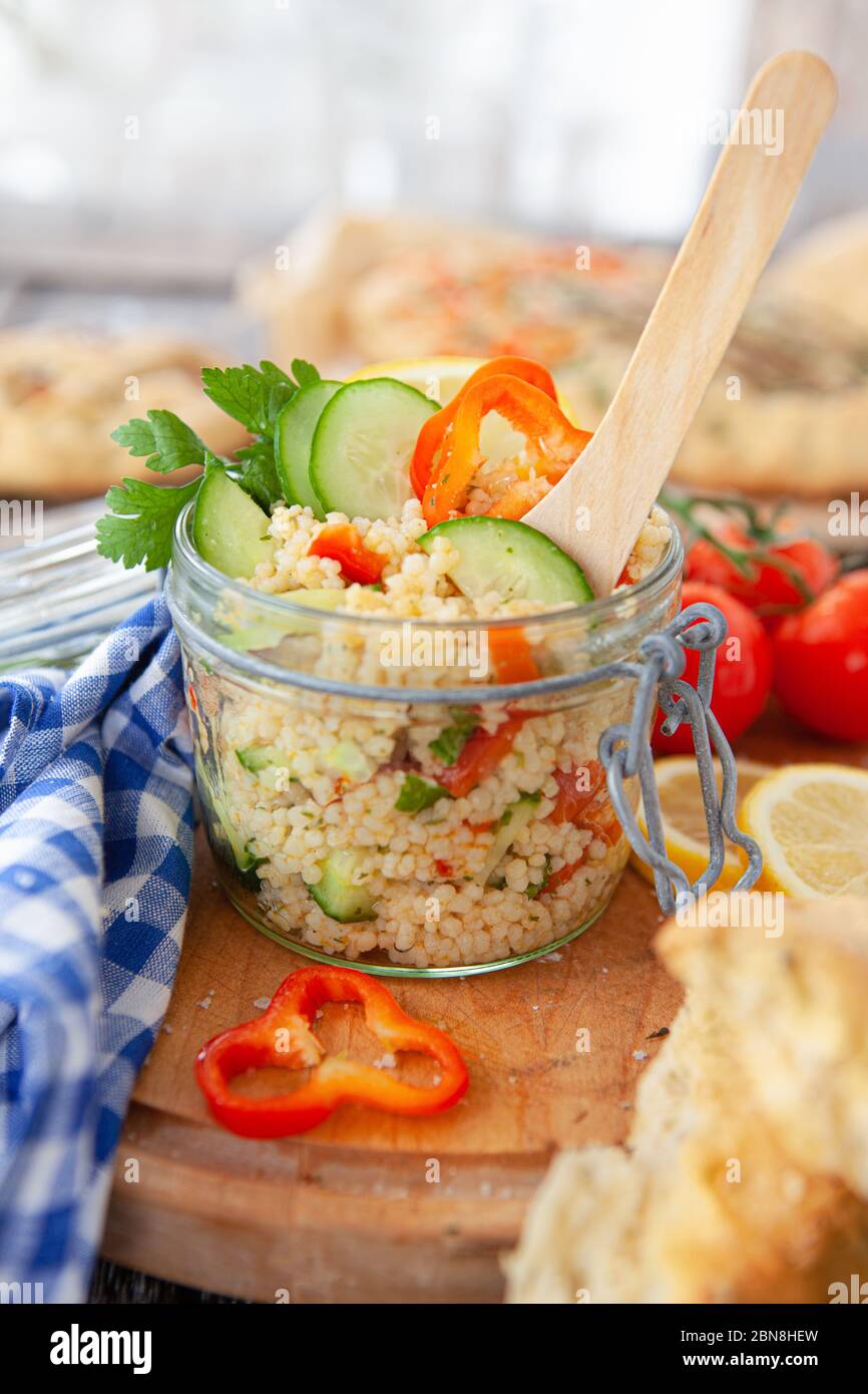 Homemade Ptitim / Israeli Couscous salad with fresh herbs Stock Photo ...