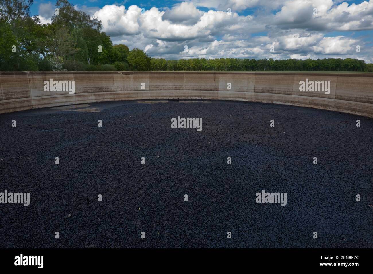 Storage of manure in a concrete pit Stock Photo - Alamy